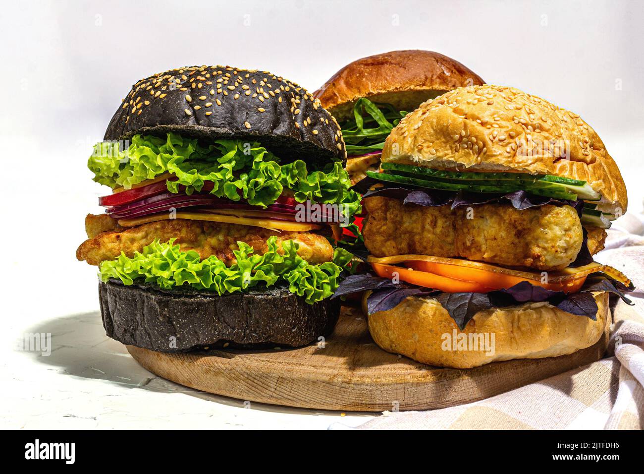 Set of homemade fish burgers. Fresh ingredients, ripe vegetables, fast ...