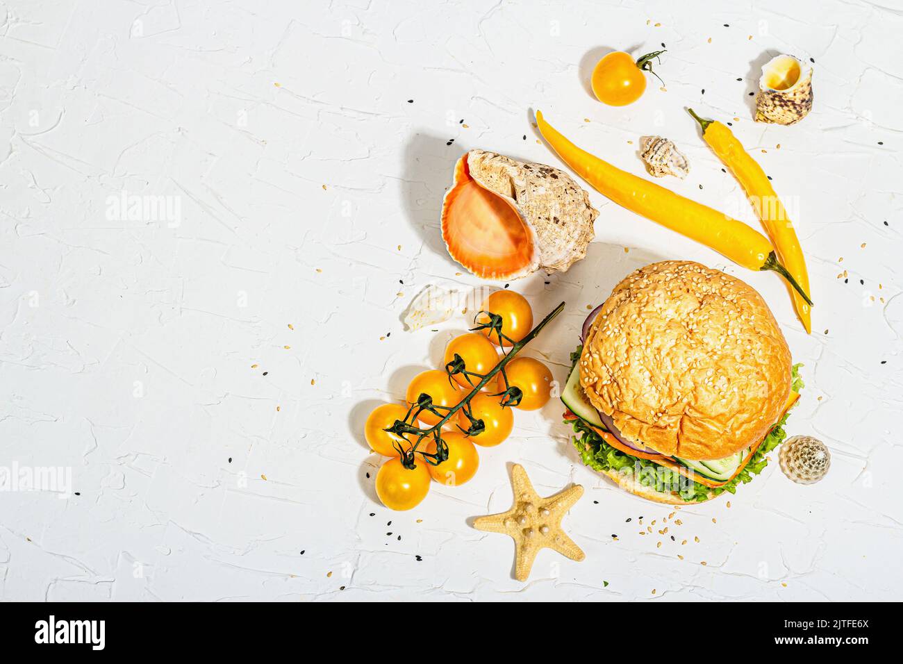 Homemade fish burger. Fresh ingredients, ripe vegetables, fast food ...