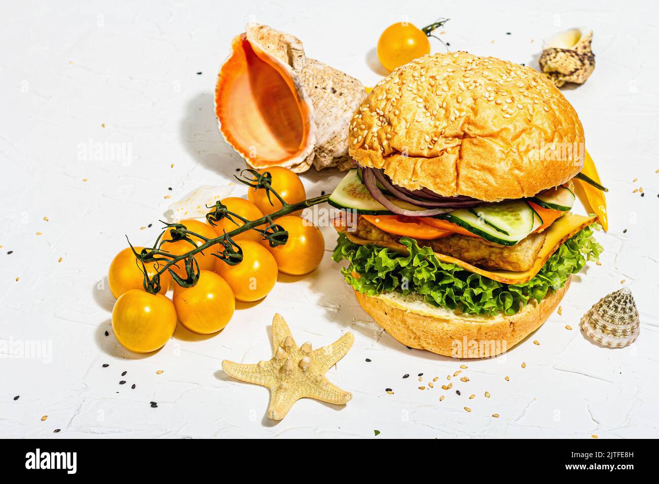 Homemade fish burger. Fresh ingredients, ripe vegetables, fast food ...