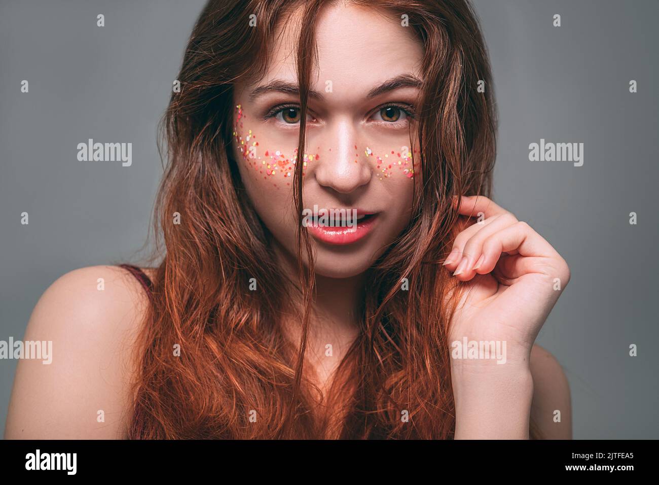 young fashion model portrait teasing suspicion Stock Photo - Alamy