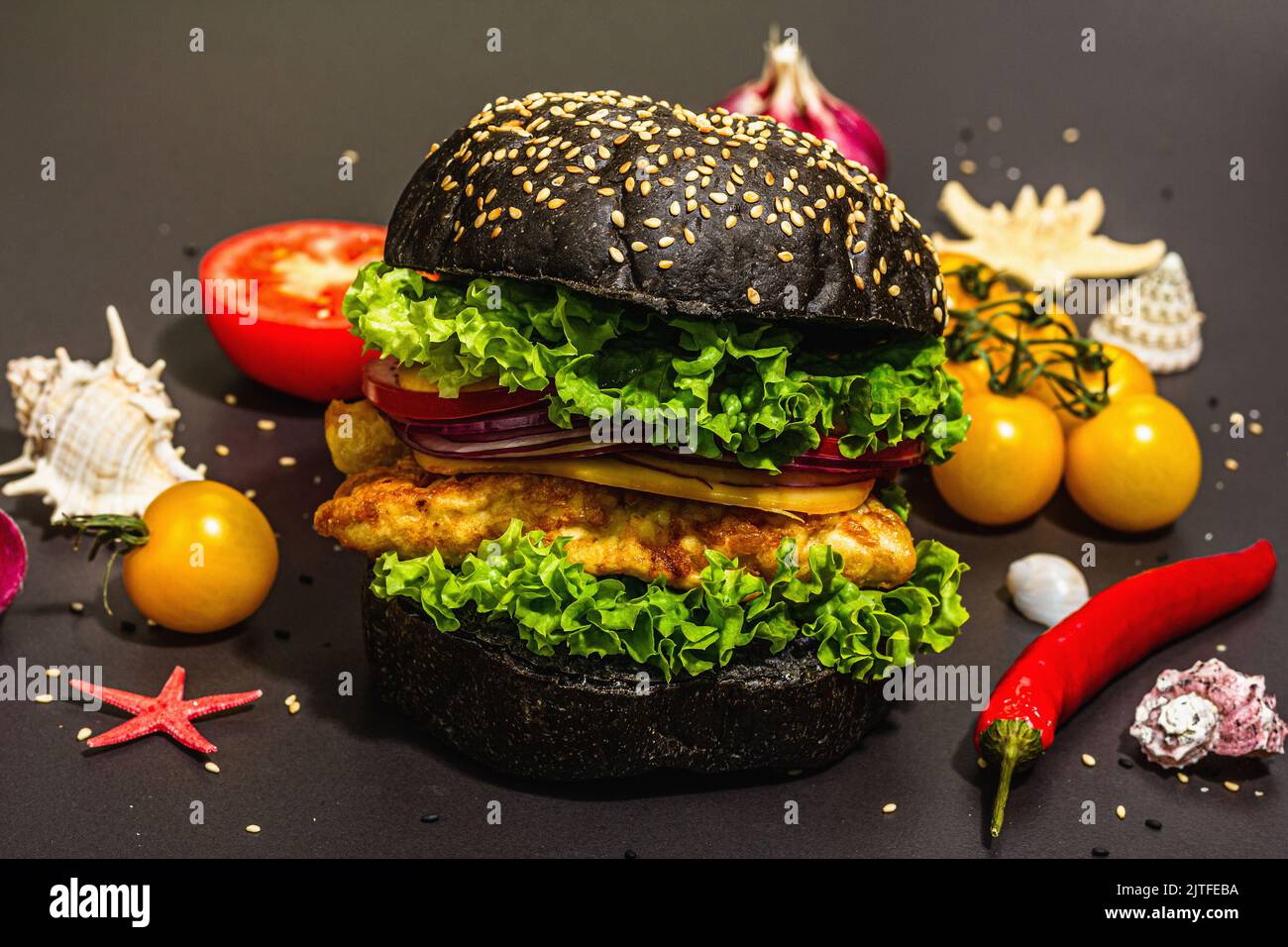 Homemade fish burger. Fresh ingredients, ripe vegetables, fast food ...