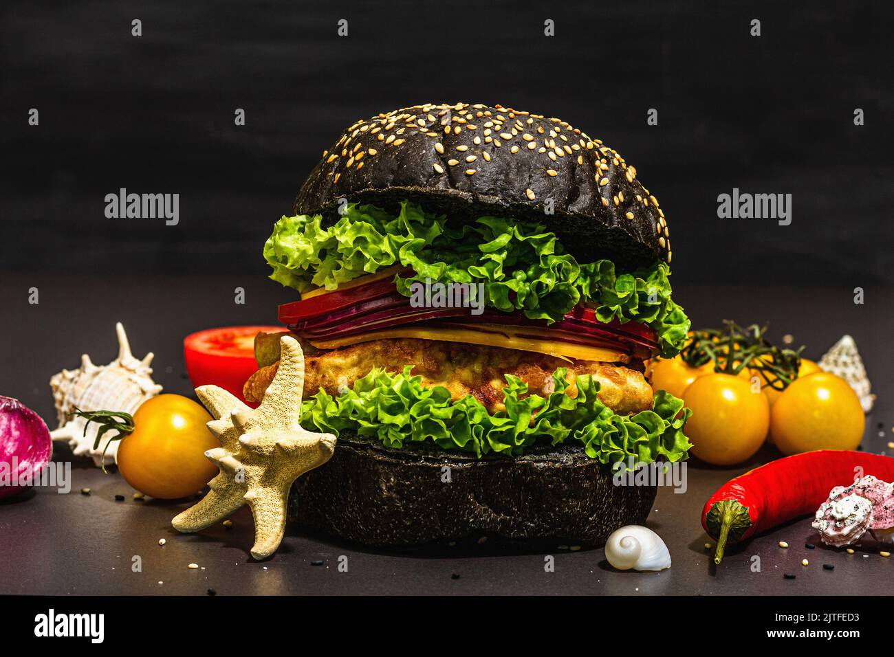 Homemade fish burger. Fresh ingredients, ripe vegetables, fast food ...