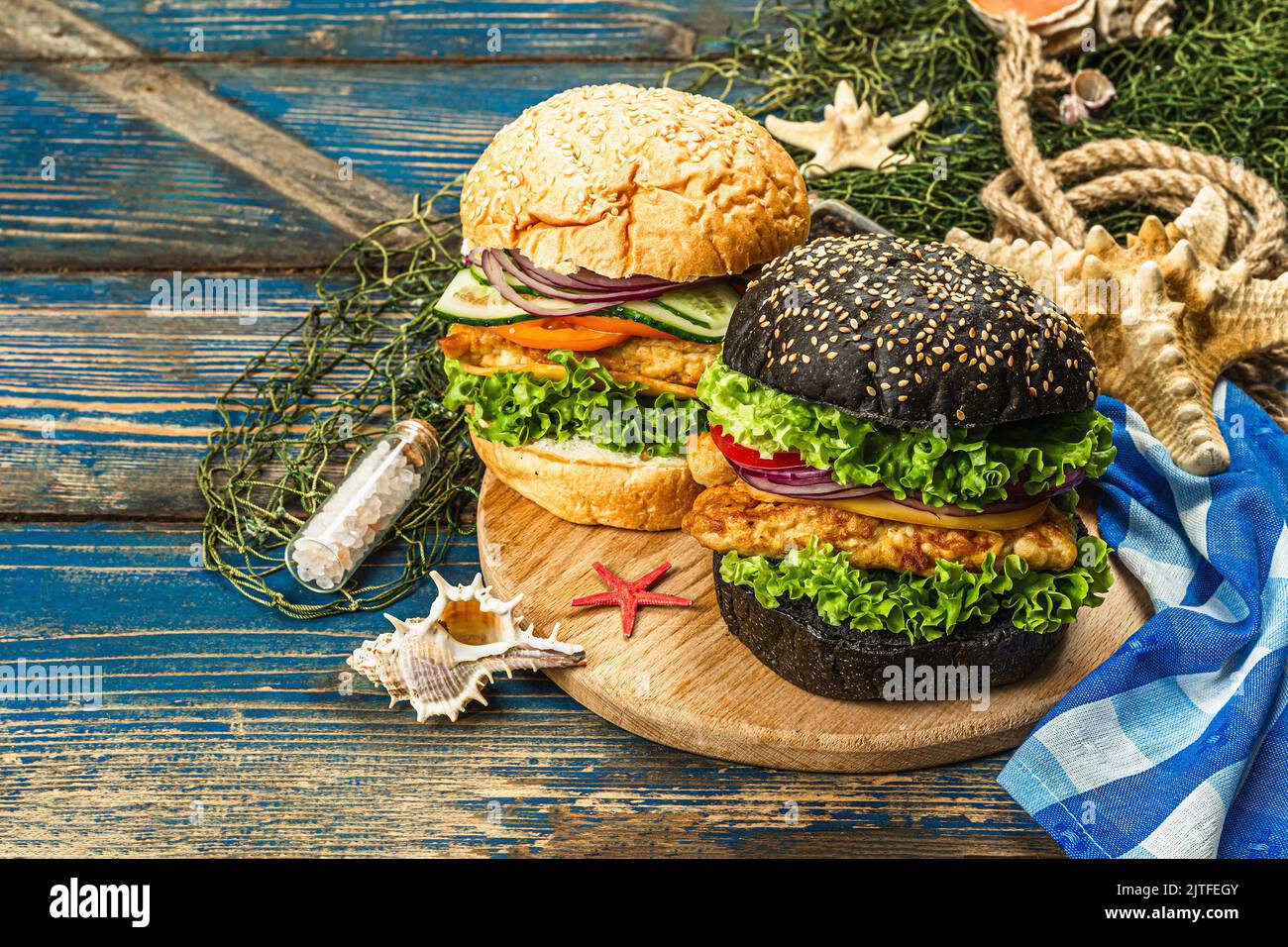 Homemade fish burgers. Fresh ingredients, ripe vegetables, fast food ...