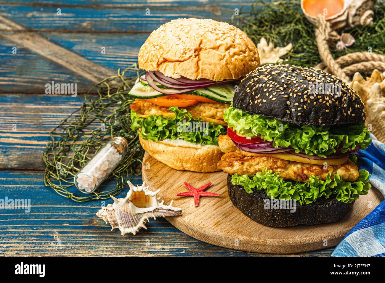 Homemade fish burgers. Fresh ingredients, ripe vegetables, fast food ...