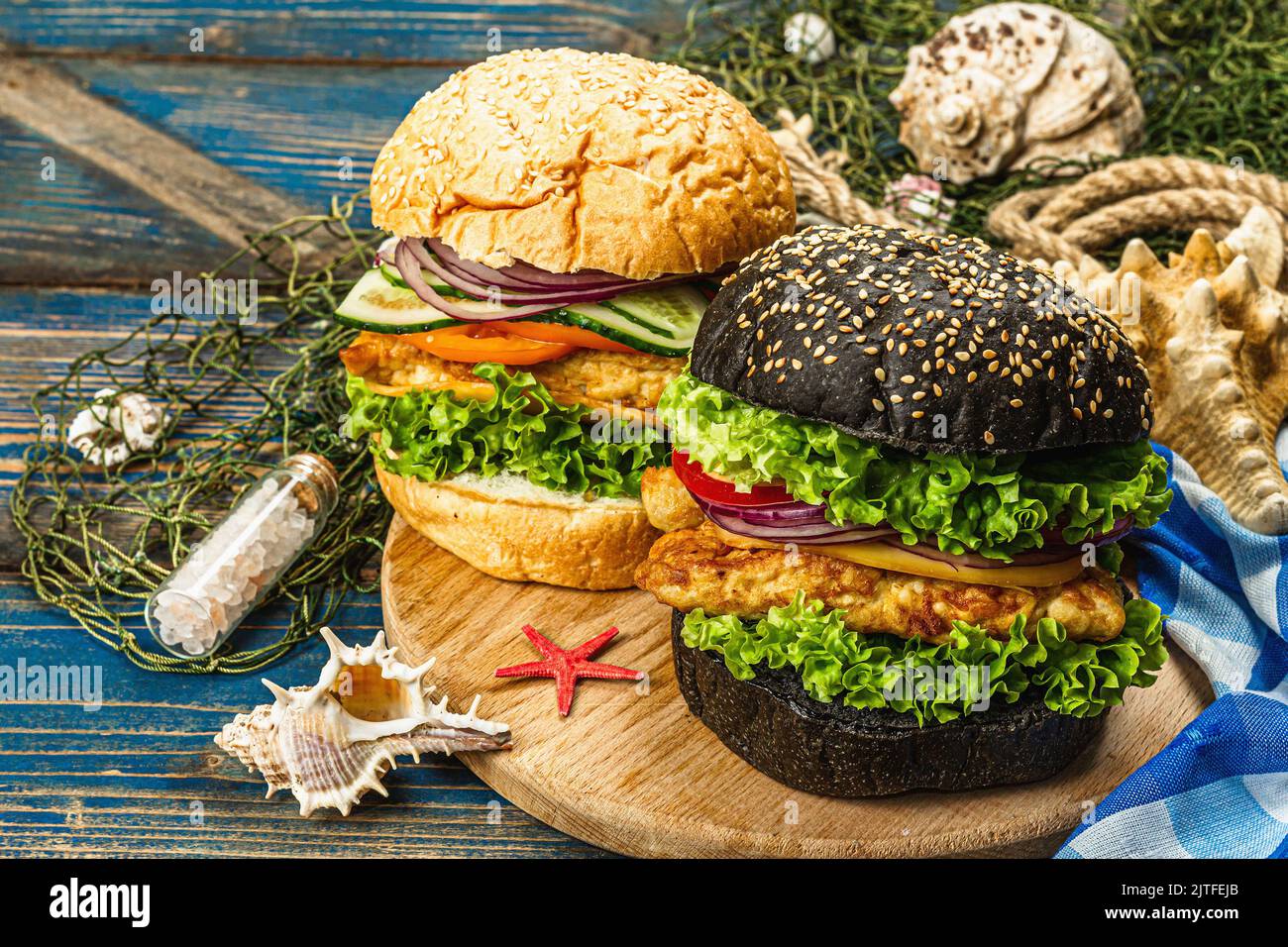 Homemade fish burgers. Fresh ingredients, ripe vegetables, fast food ...