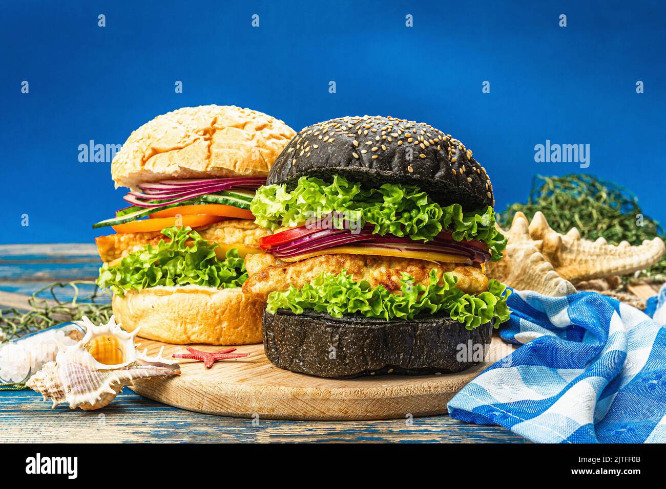 Homemade fish burgers. Fresh ingredients, ripe vegetables, fast food ...