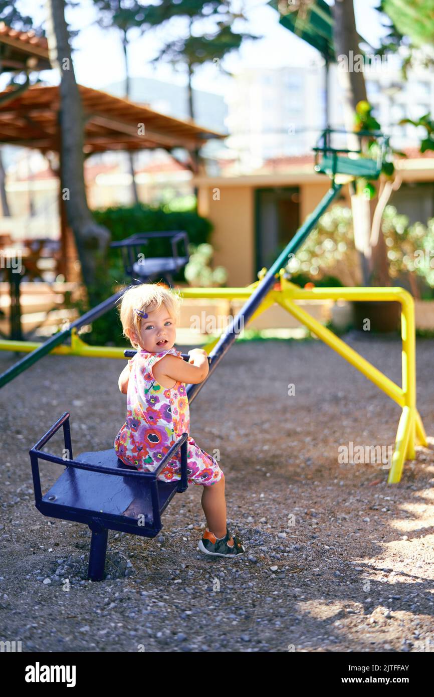 Teeter totter children hi-res stock photography and images - Alamy