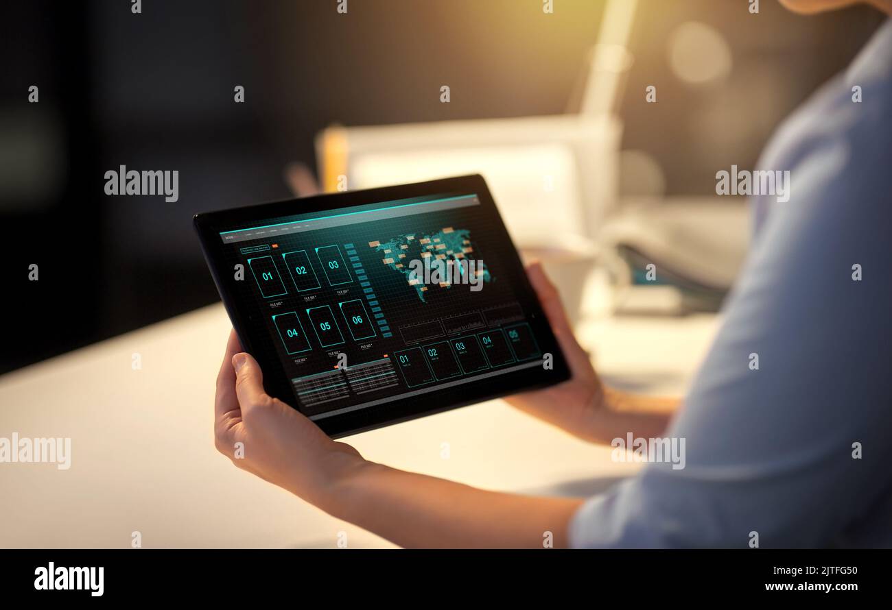 businesswoman with tablet computer at night office Stock Photo - Alamy