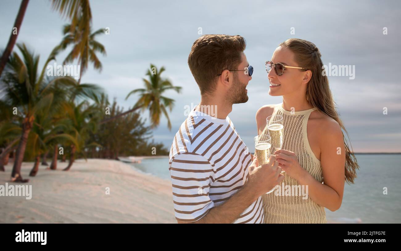 happy couple drinking champagne on summer beach Stock Photo - Alamy