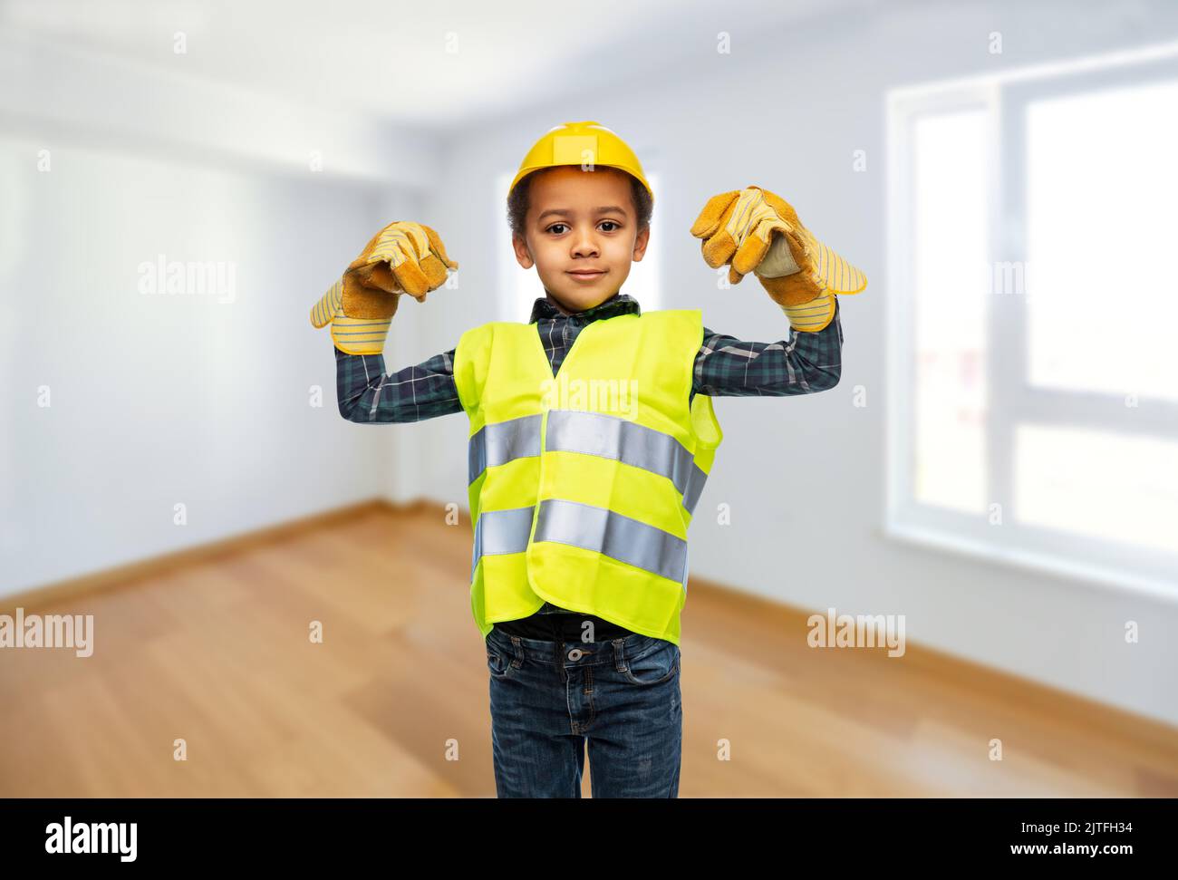 little boy in gloves, safety vest and helmet Stock Photo - Alamy