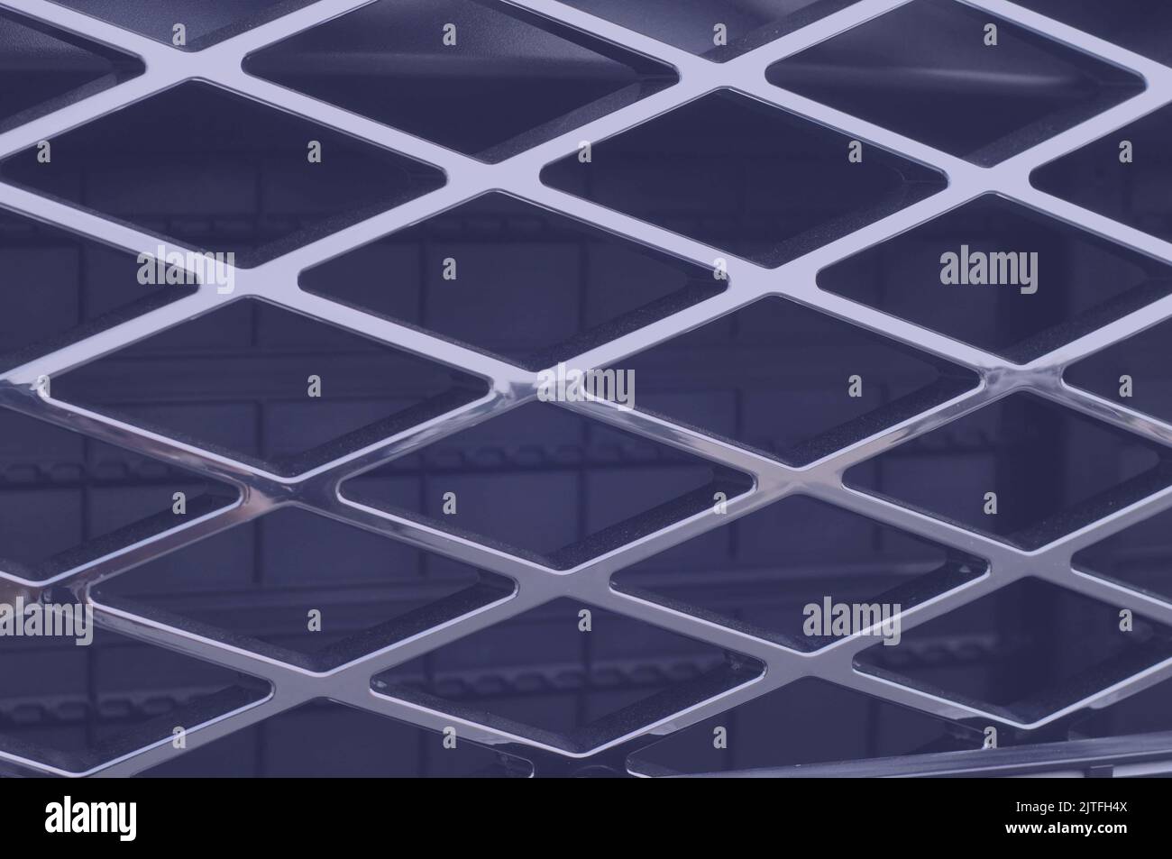 Chrome-plated radiator grille of a modern car close-up. Background ...