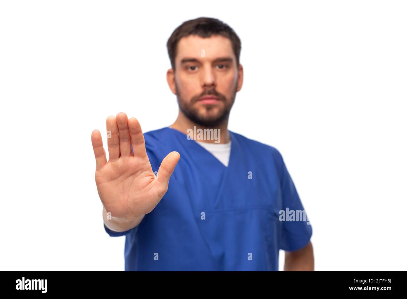 doctor or male nurse showing stop gesture Stock Photo - Alamy