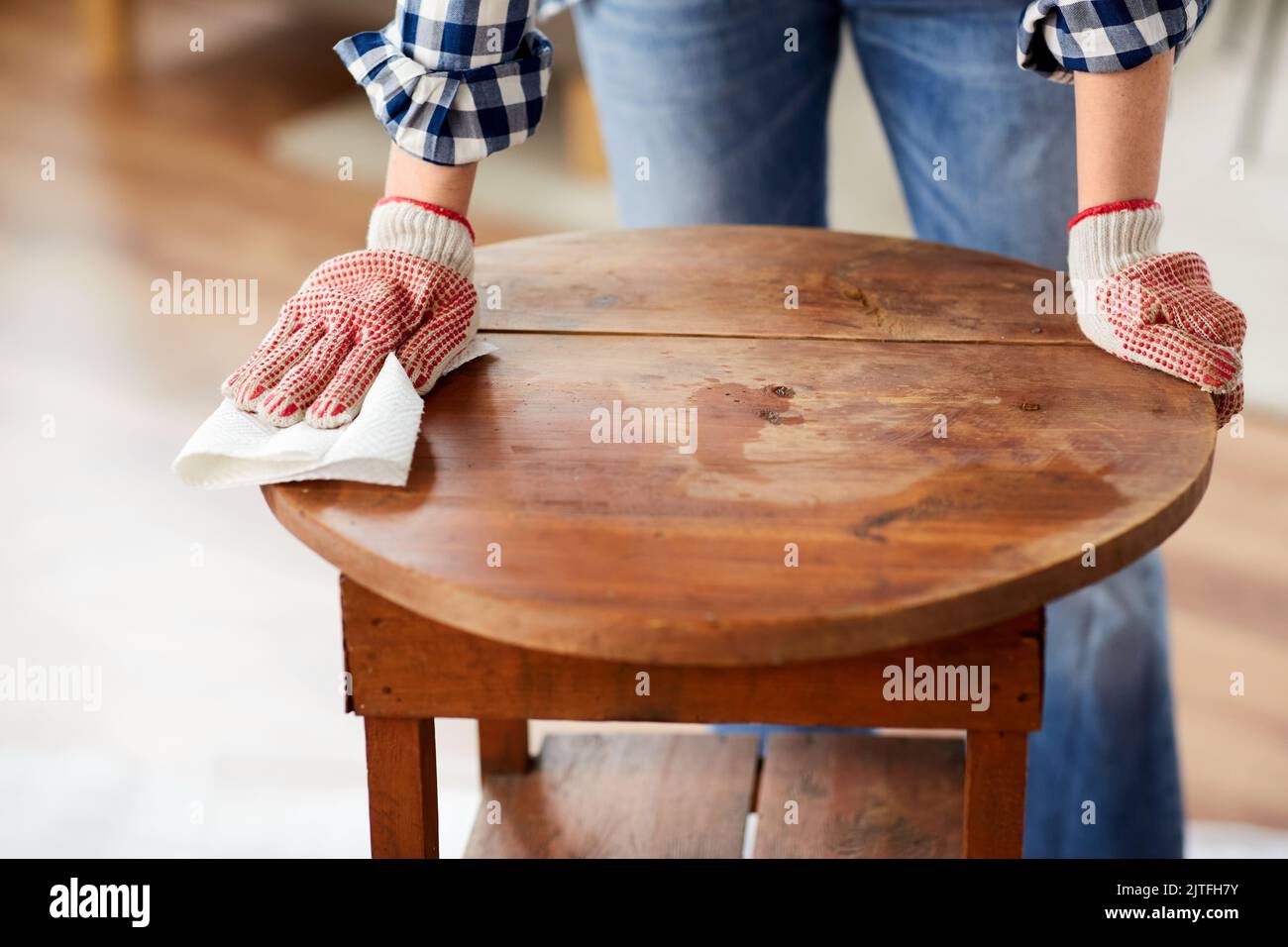 woman cleaning old table surface with paper tissue Stock Photo - Alamy
