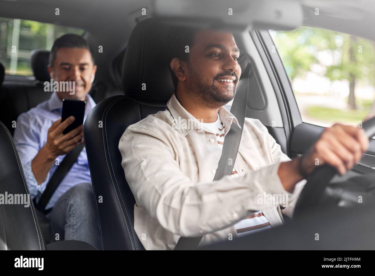 indian male driver driving car with passenger Stock Photo - Alamy