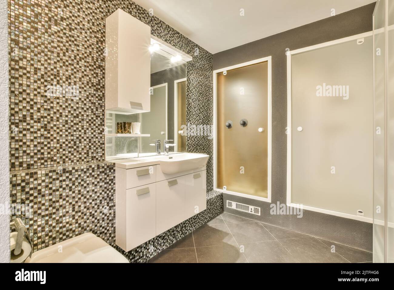 Sink with tap and mirror and door in contemporary bathroom at home ...