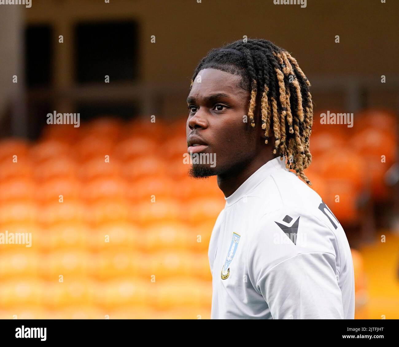 Alex Mighten of Sheffield Wednesday inspects the pitch before the game ...