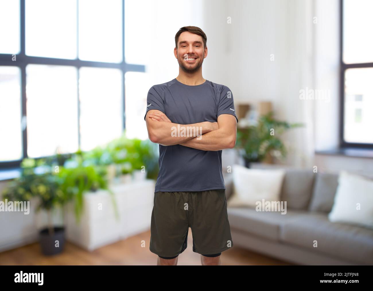 Confident athletic man smiling hi-res stock photography and images - Alamy