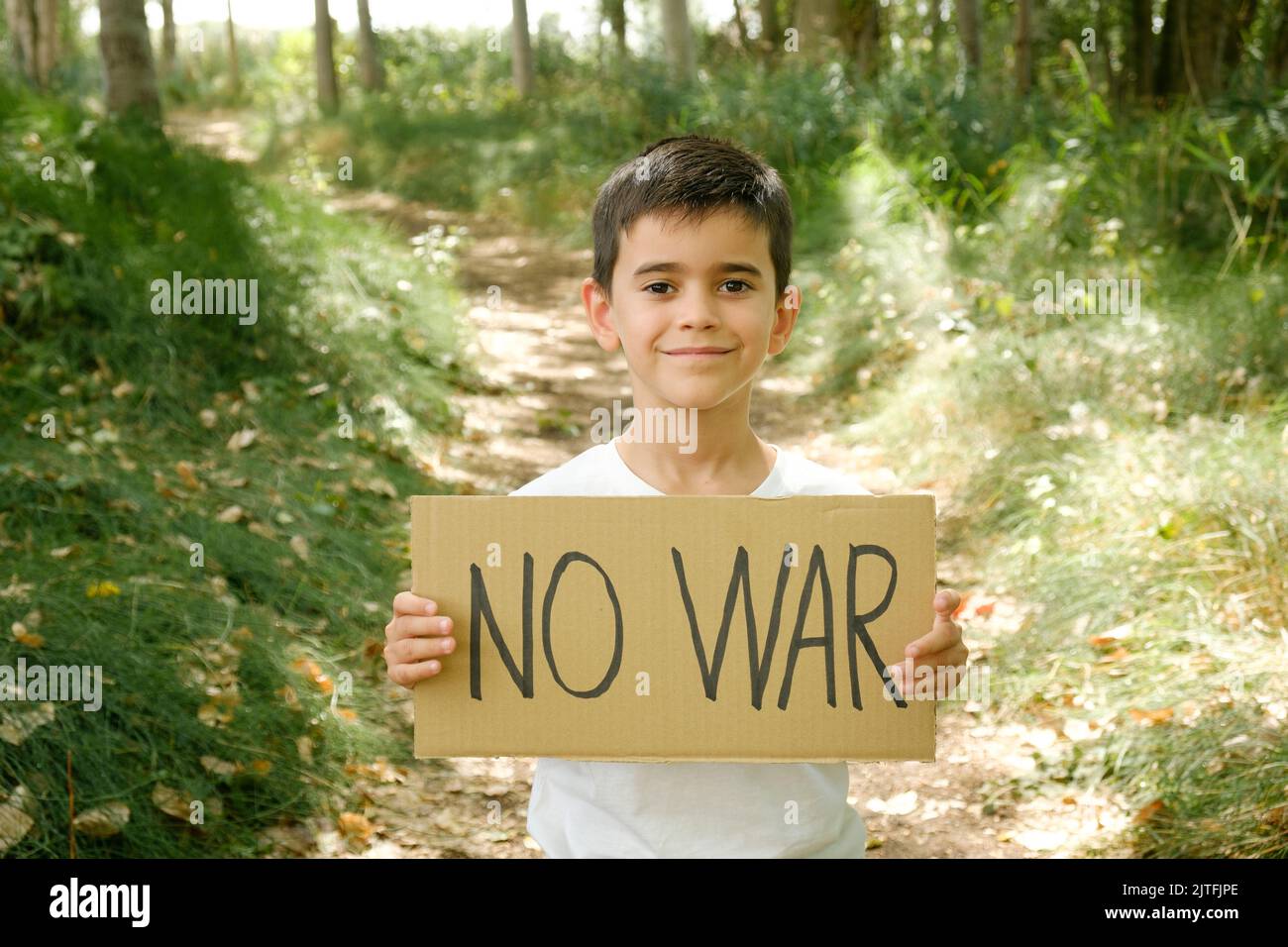 child displays "no war" sign in the wild Stock Photo - Alamy