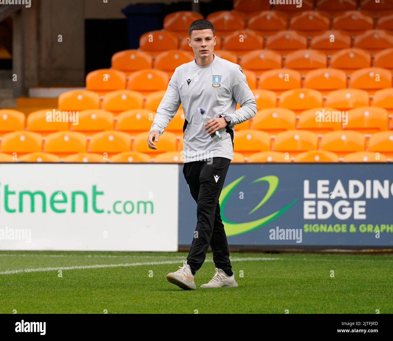 Alex Hunt #29 of Sheffield Wednesday inspects the pitch before the game ...
