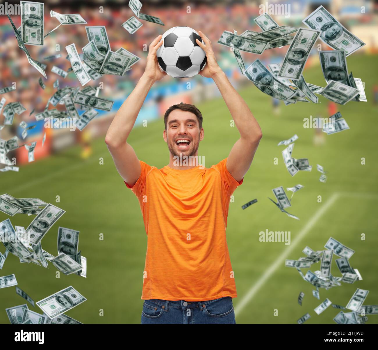 happy man with soccer ball over money Stock Photo - Alamy
