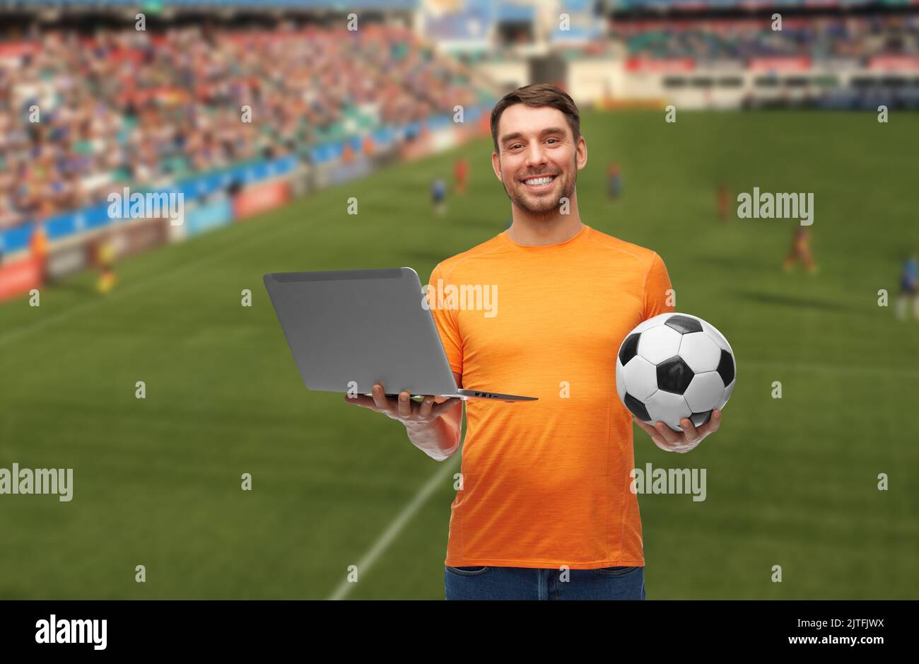 man or football fan with soccer ball and laptop Stock Photo - Alamy