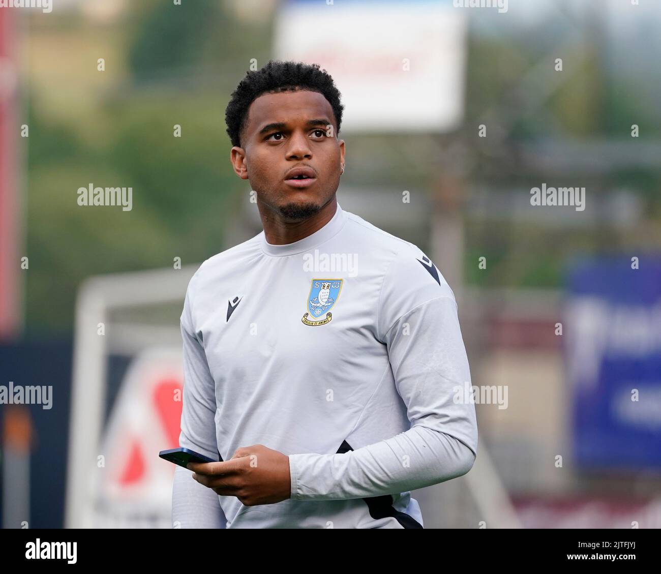 Akin Famewo #15 of Sheffield Wednesday inspects the pitch before the ...
