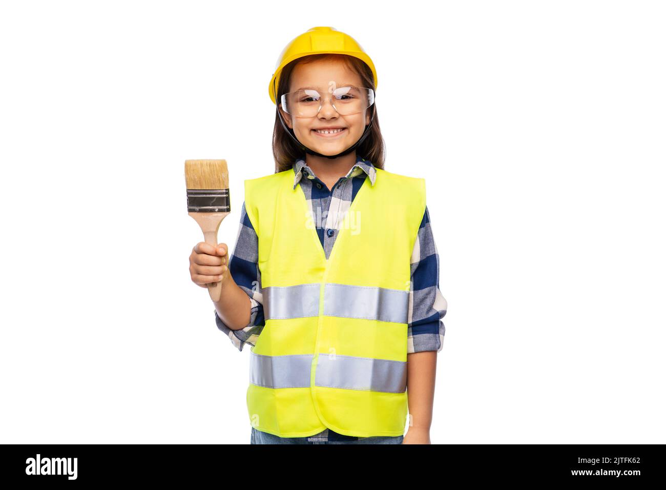 girl in helmet and safety vest with paint brush Stock Photo - Alamy