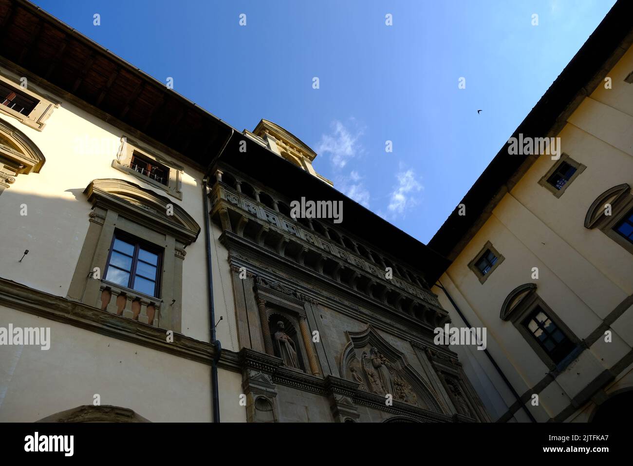 A low angle shot of an old historical building facade and a blue sky ...