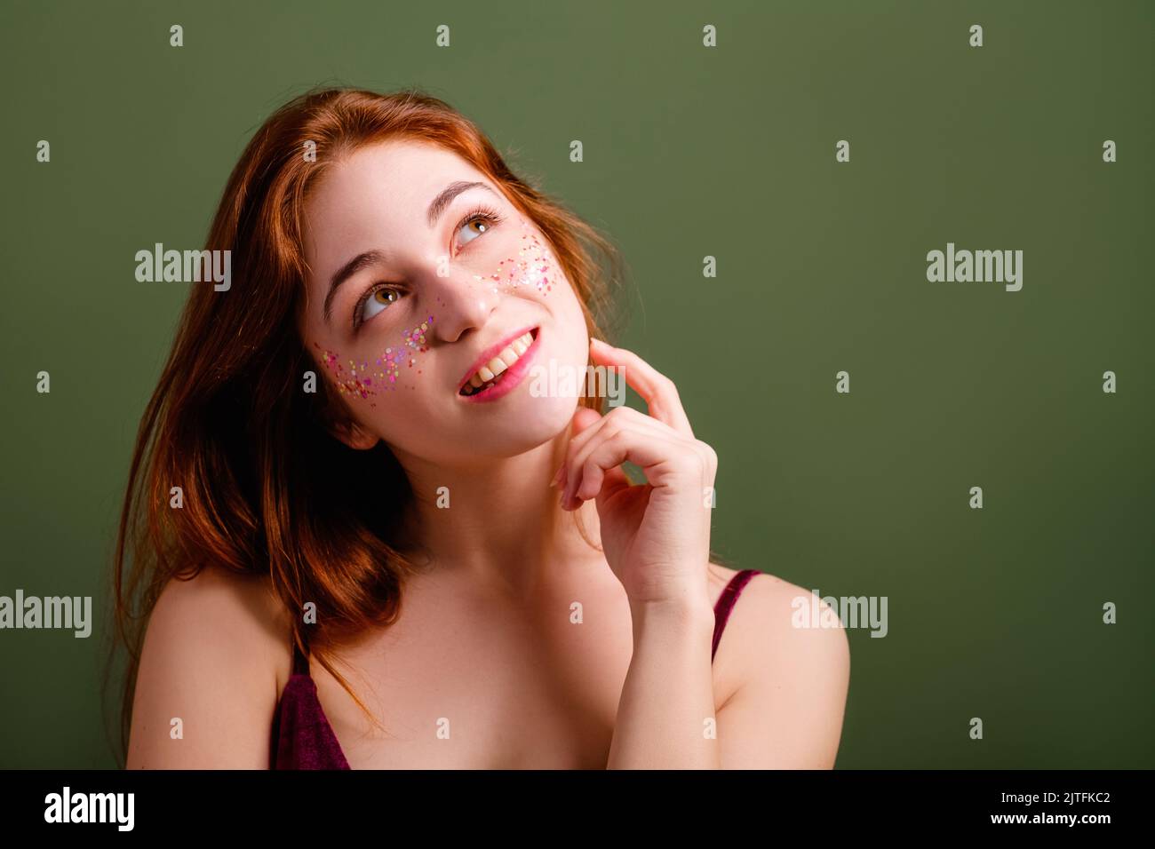 cute young woman choice redhead looking curiously Stock Photo - Alamy