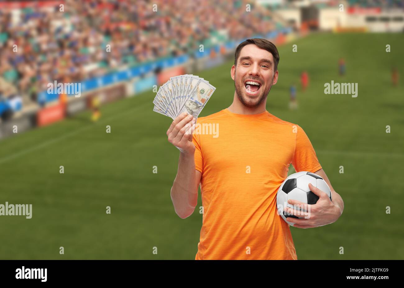 happy football fan with soccer ball and money Stock Photo - Alamy