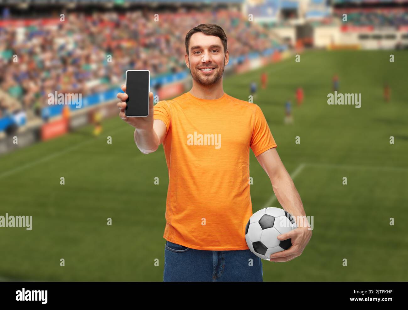 Mobile phone football shirt hi-res stock photography and images - Alamy