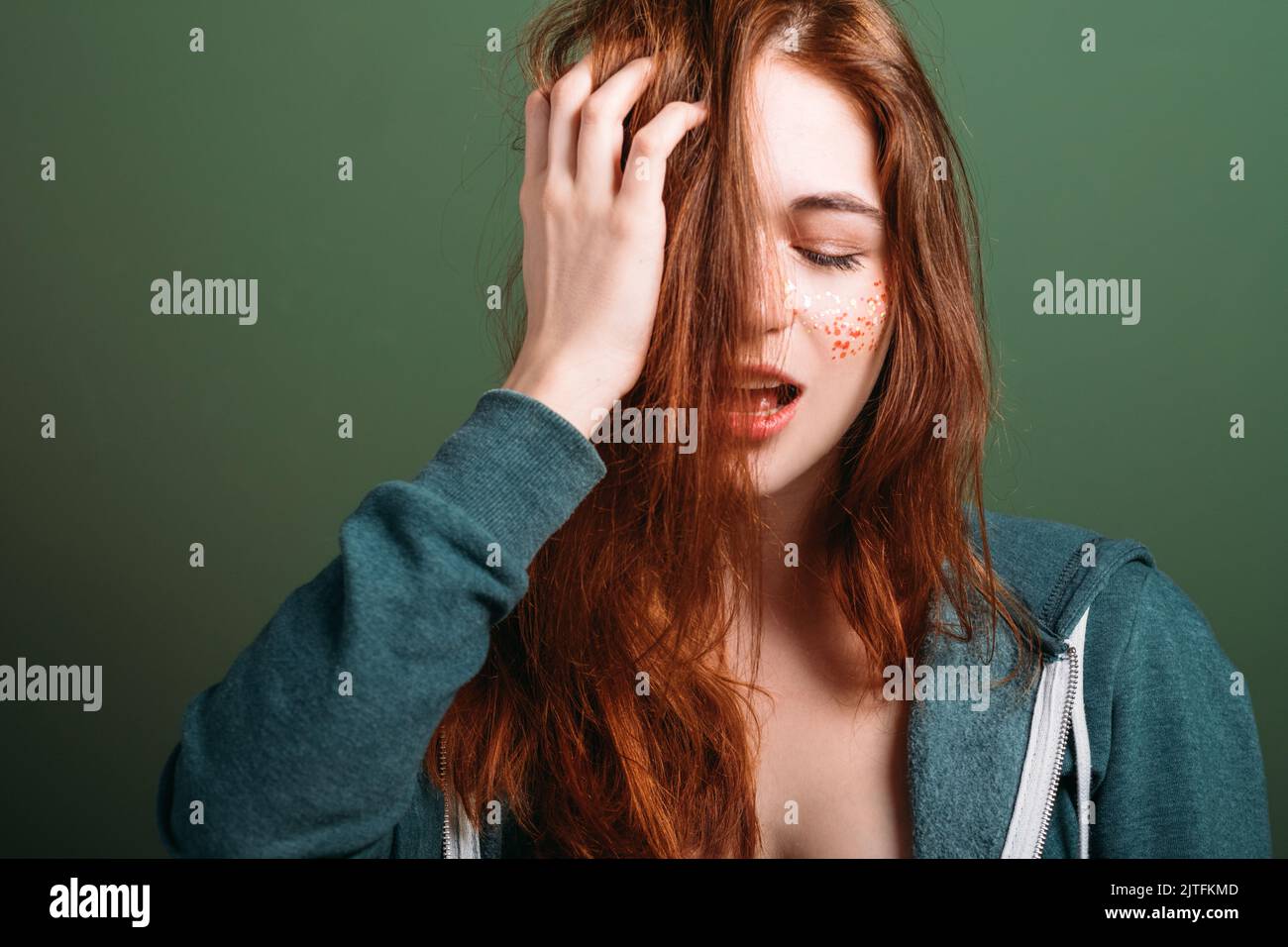 young woman messy hair tired look headache Stock Photo - Alamy
