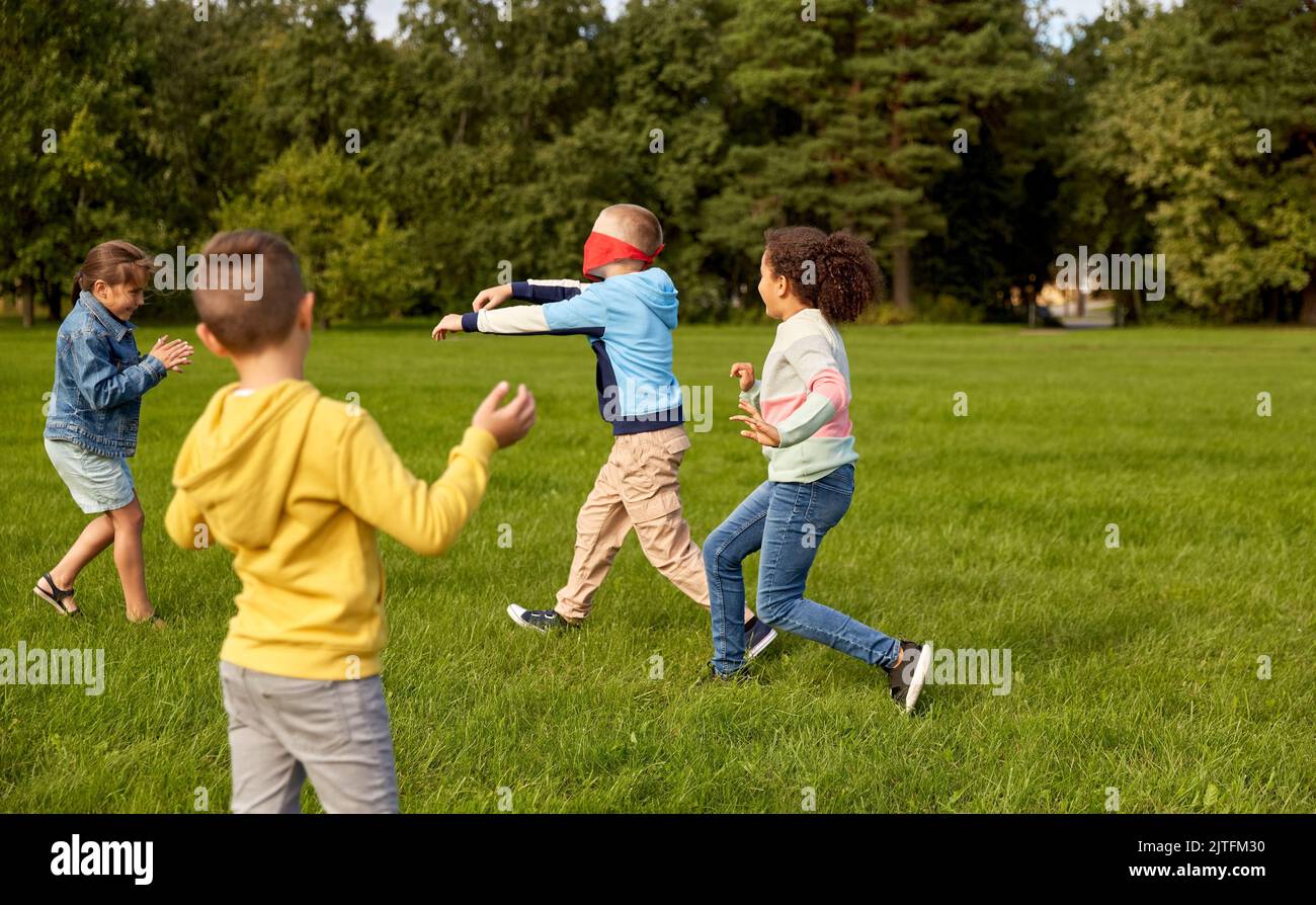 happy children playing and running at park Stock Photo - Alamy
