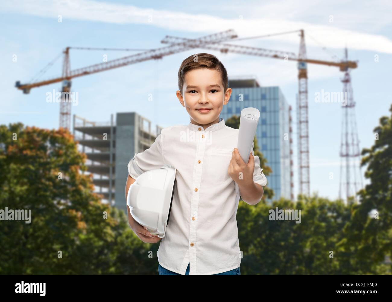 boy with helmet and blueprint at construction site Stock Photo - Alamy