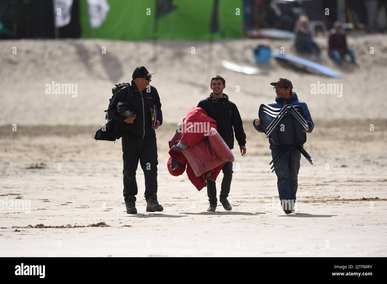 People walking on the beach Stock Photo - Alamy