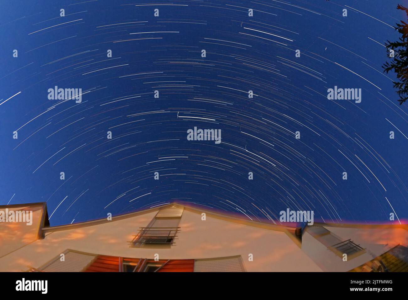 Night stars movement over the facade of the house Stock Photo - Alamy