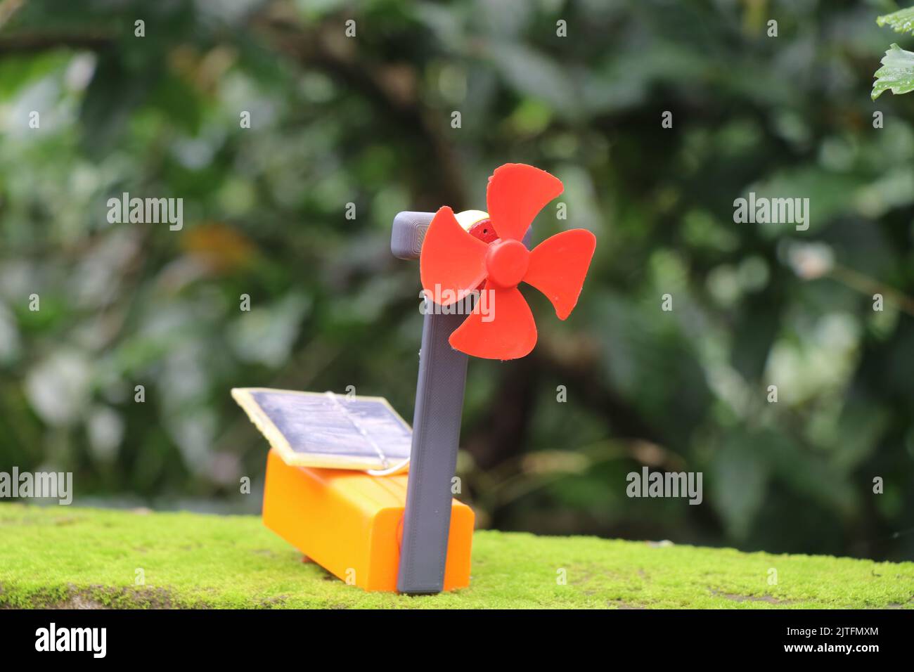 Small propeller or fan attached to a dc motor that runs on a solar ...