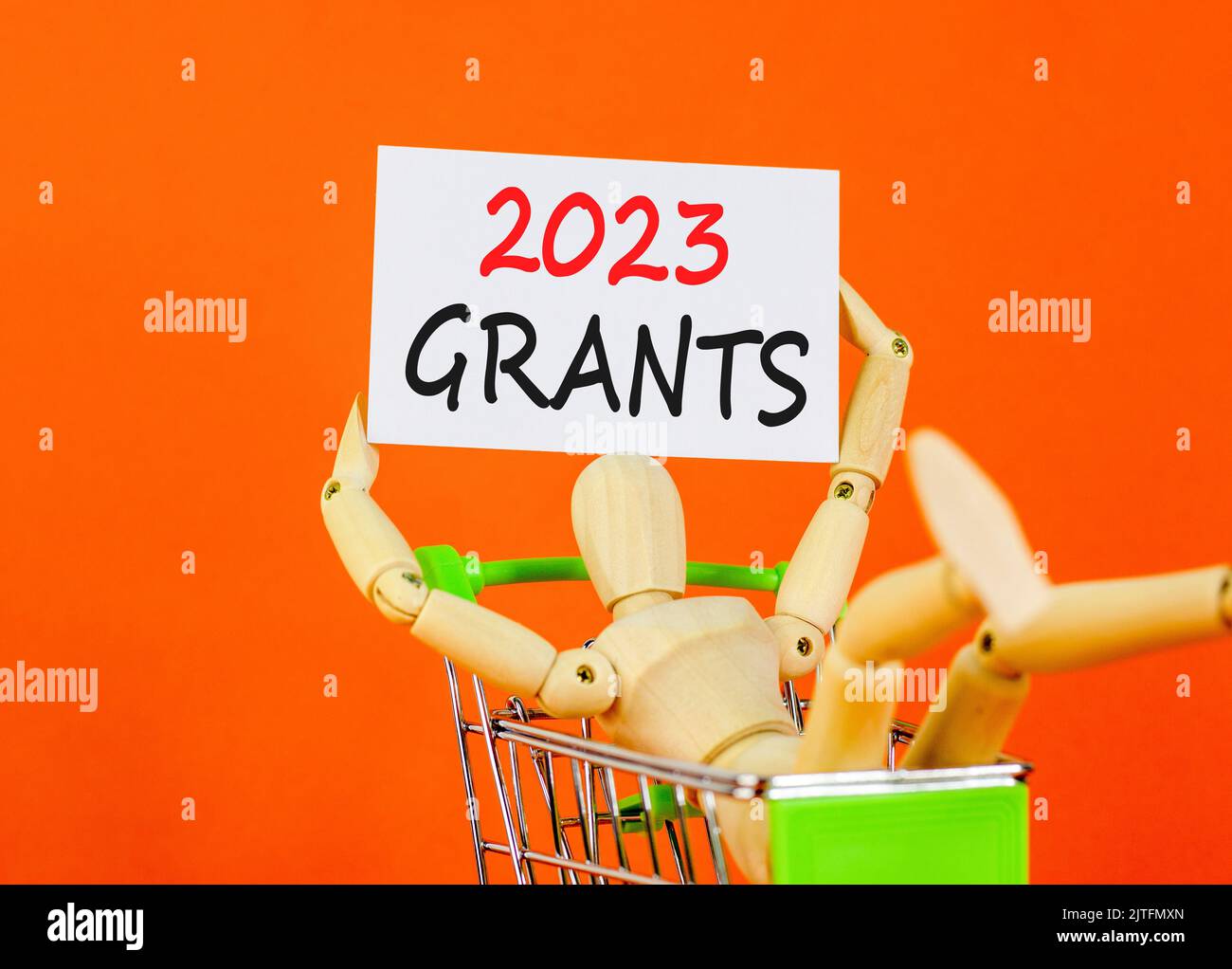 2023 Grants symbol. White paper with words 2023 Grants, human model in ...