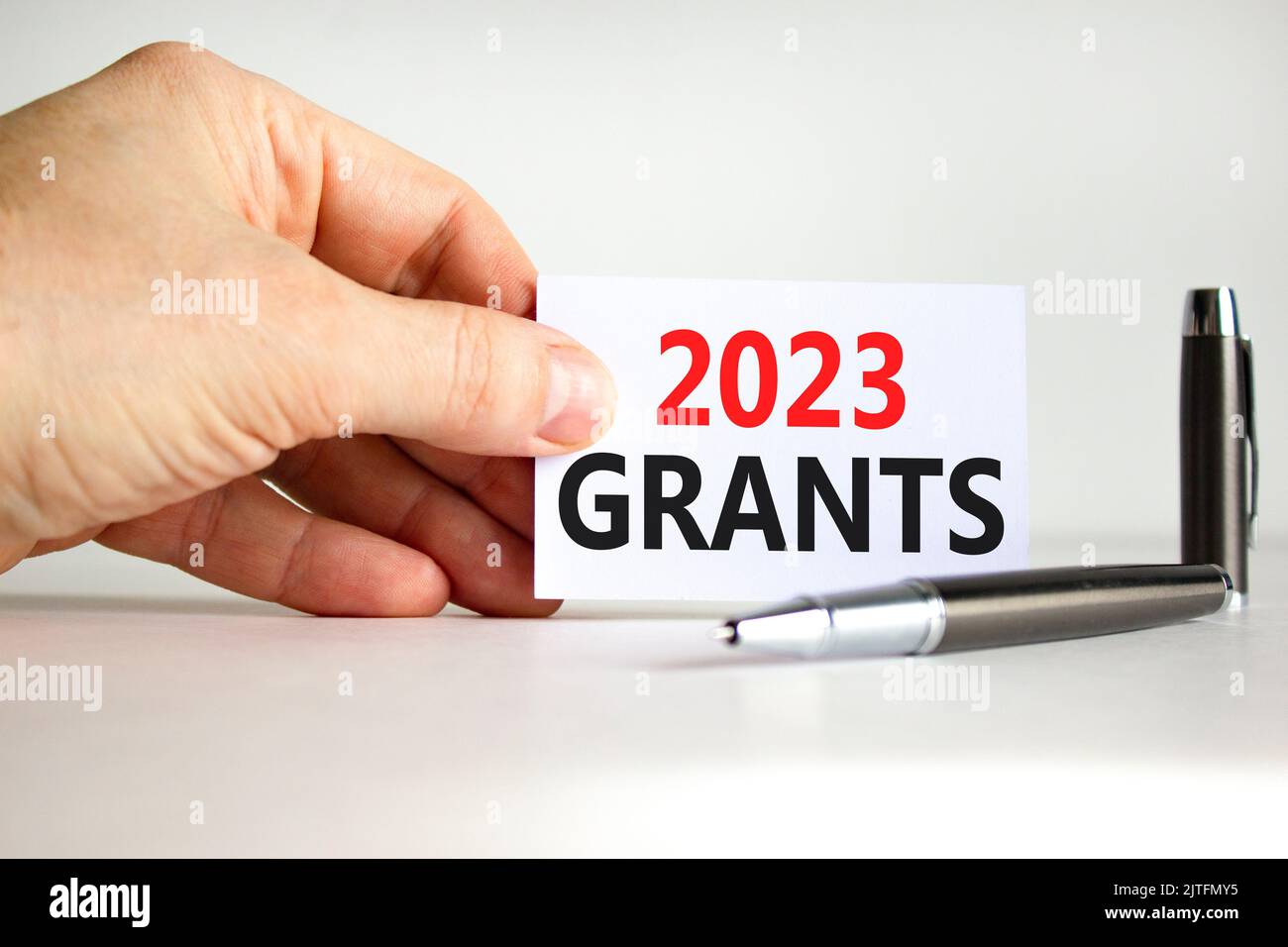 2023 Grants symbol. White paper with words 2023 Grants. Businessman ...