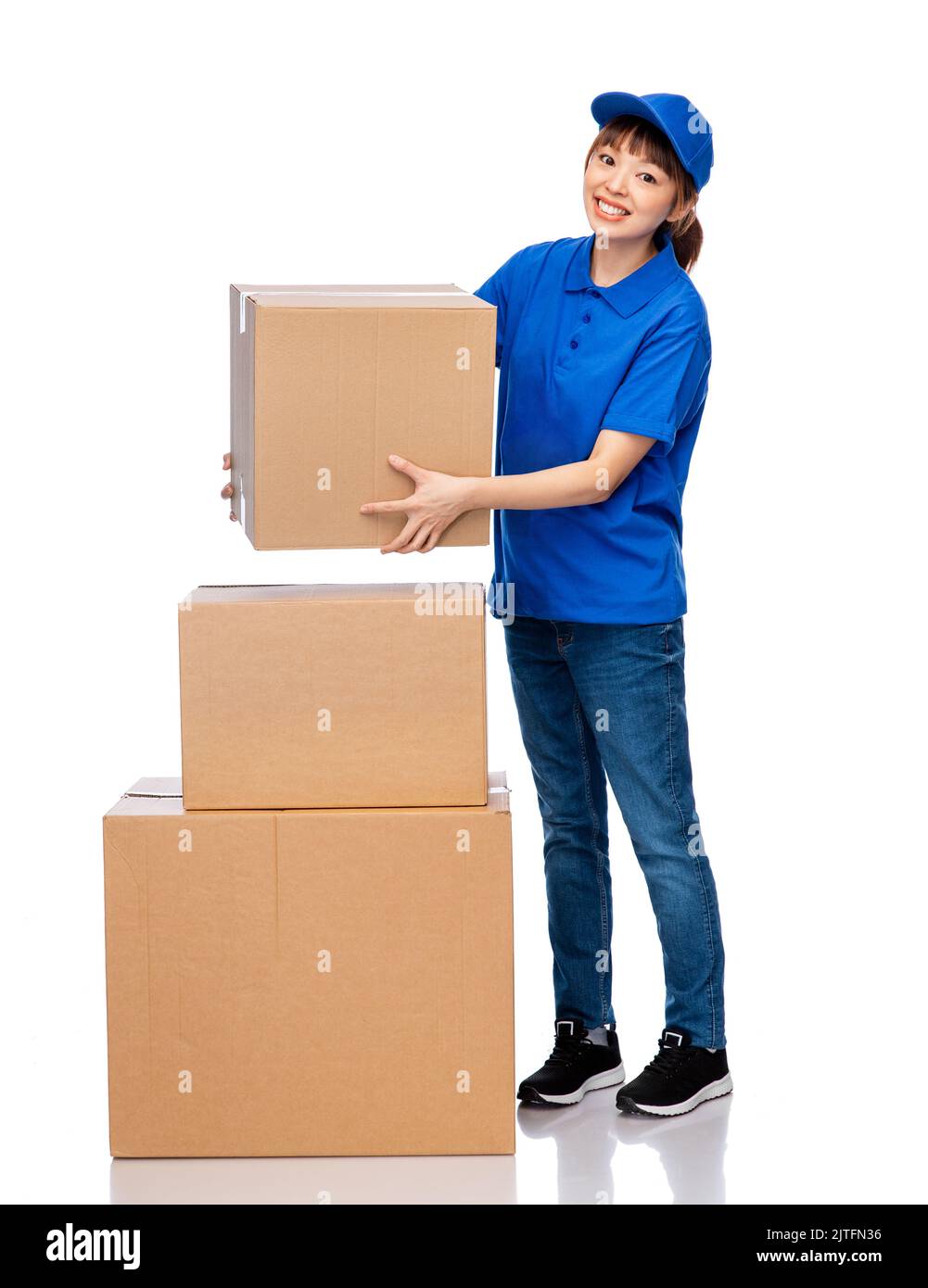 delivery woman in blue uniform with parcel boxes Stock Photo - Alamy