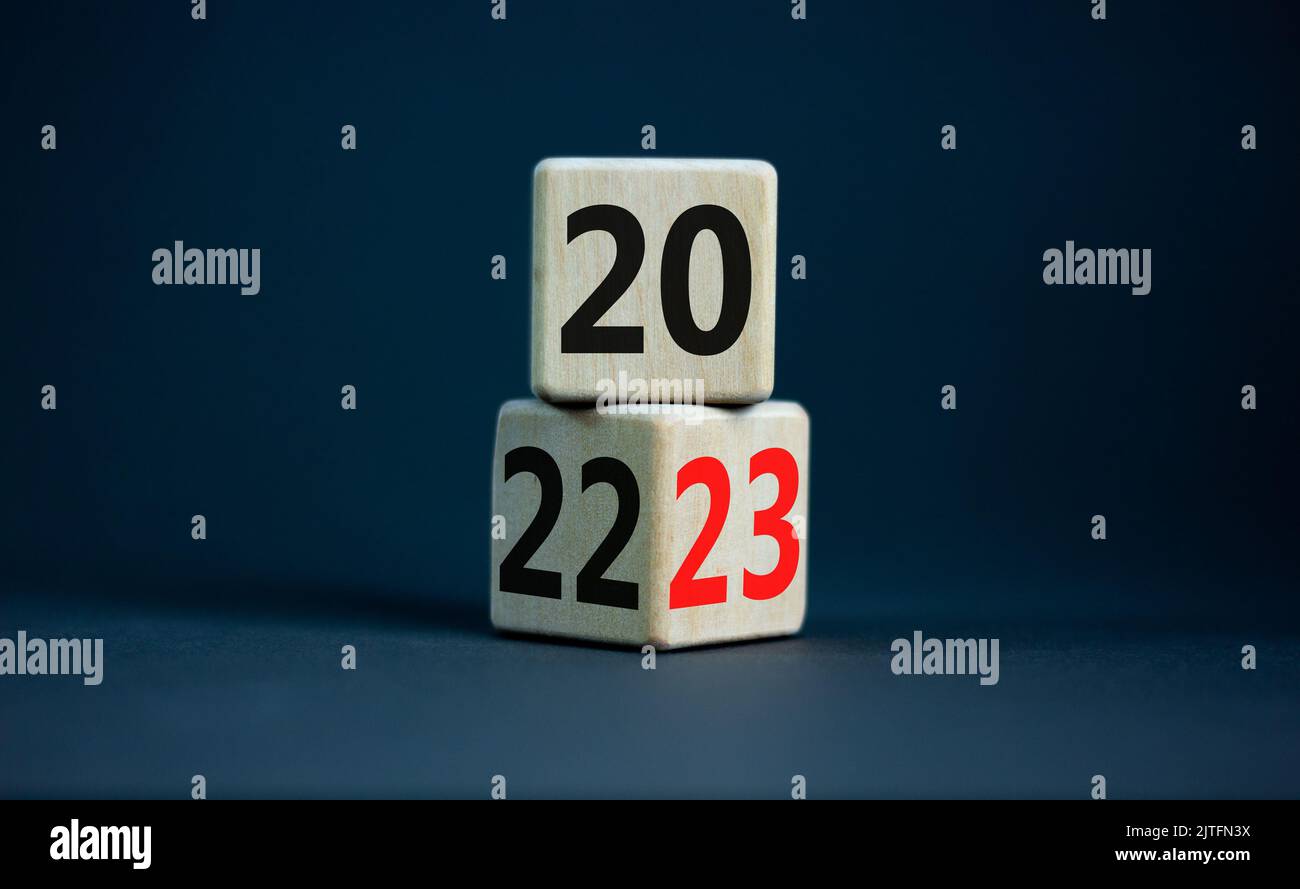 2023 happy new year symbol. Wooden cubes symbolize the change from 2022 ...