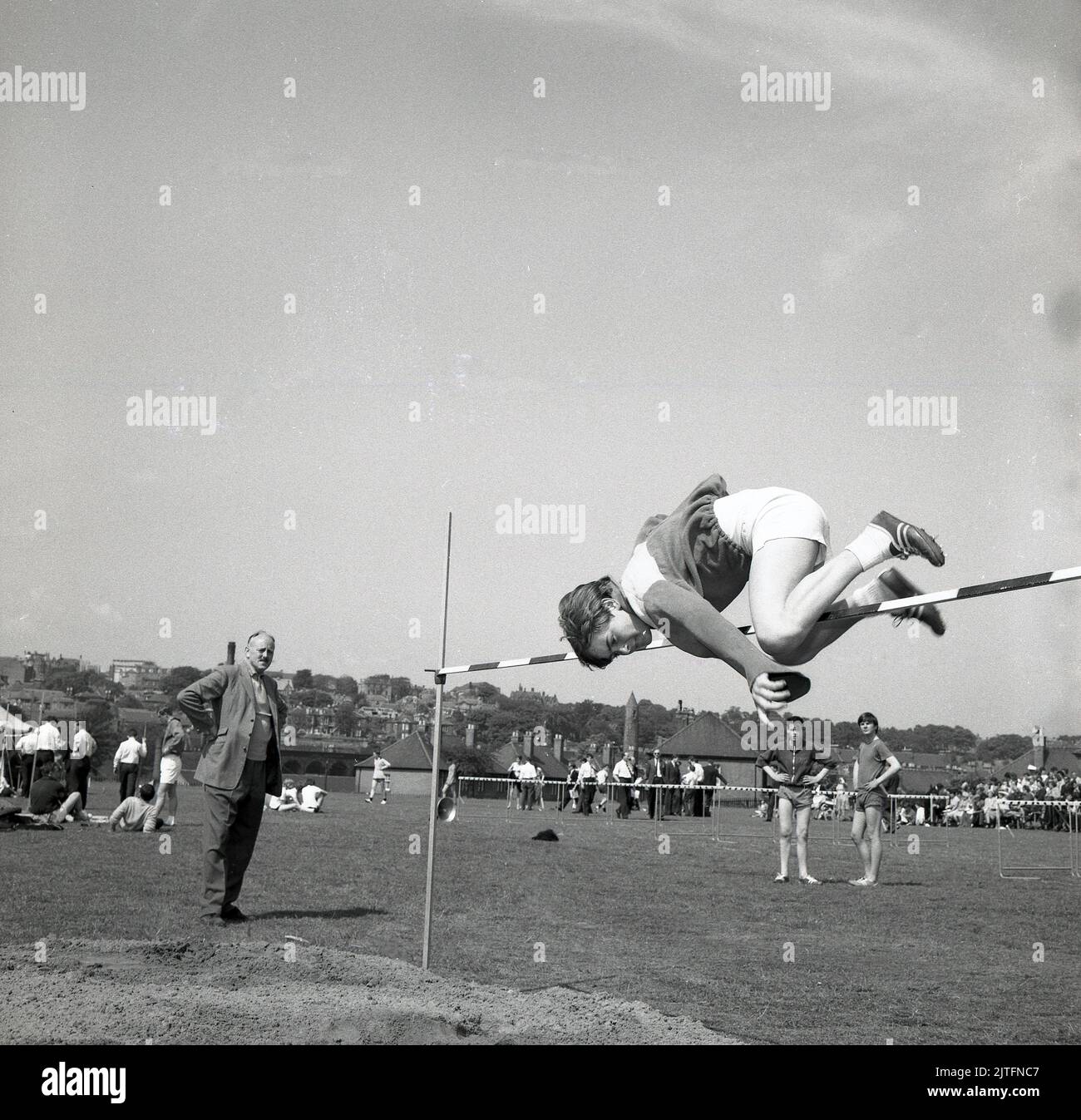 1960s, historical, outside at a county sports event, a boy doing the ...