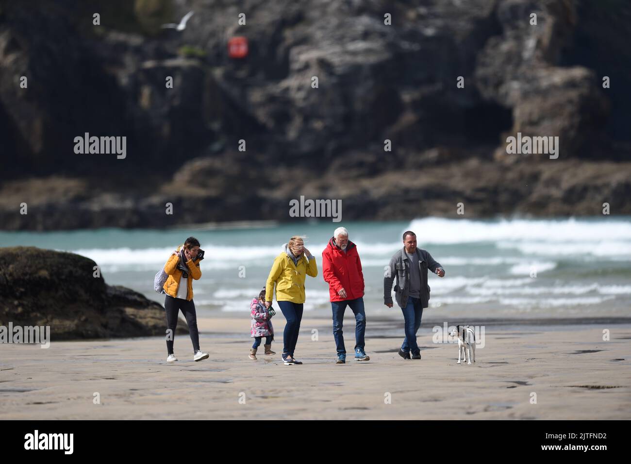 Family at the beach in jackets hi-res stock photography and images - Alamy