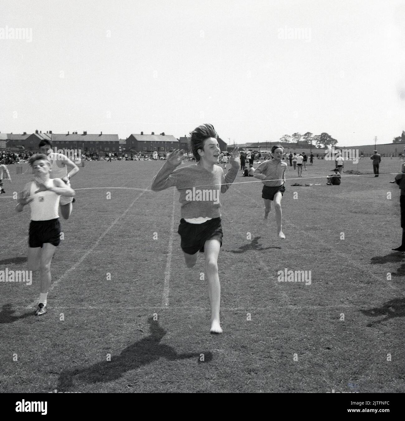 1960s, historical, county school sports, outside in a sports field, a ...