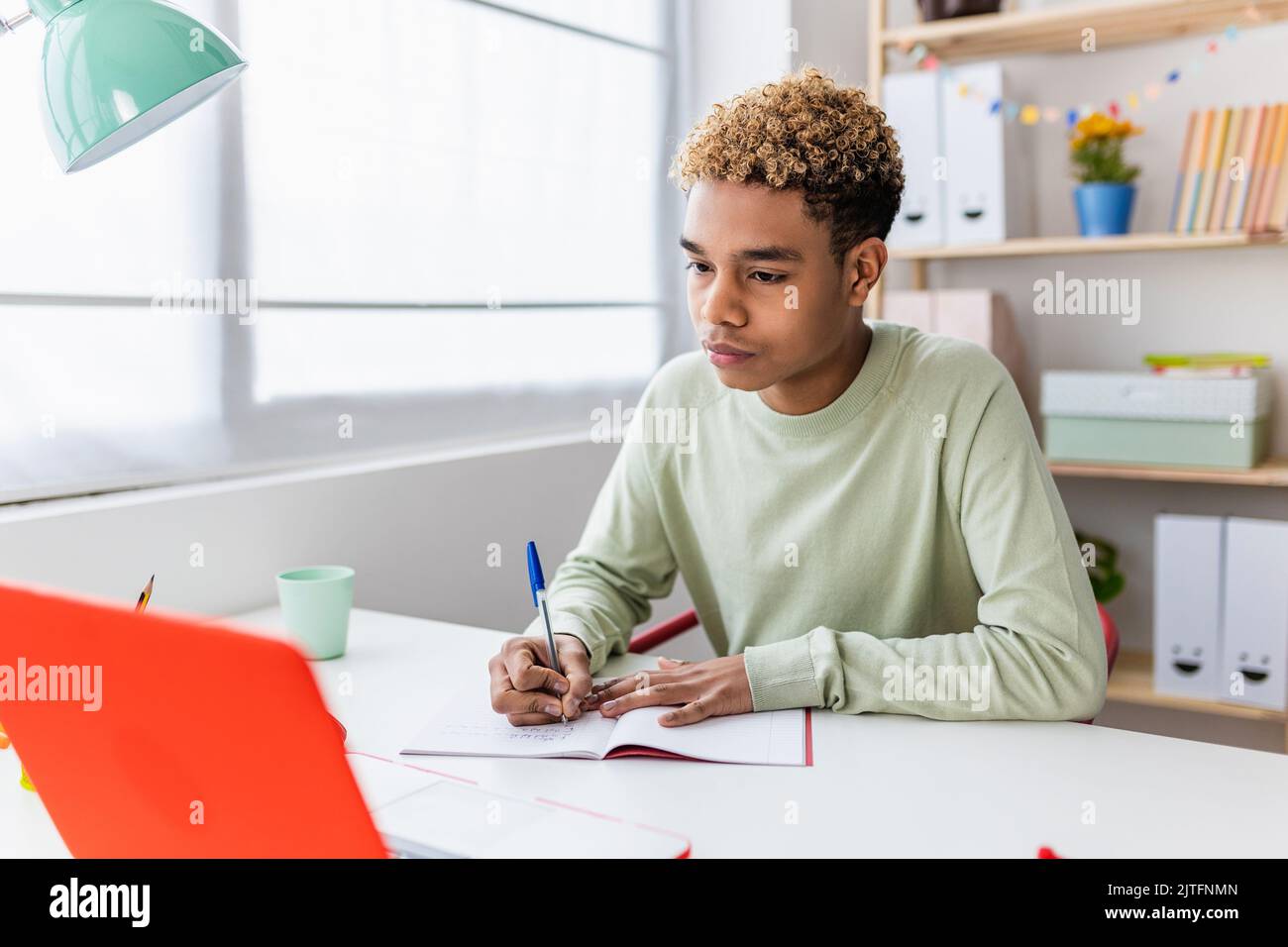 African teen boy laptop hi-res stock photography and images - Alamy