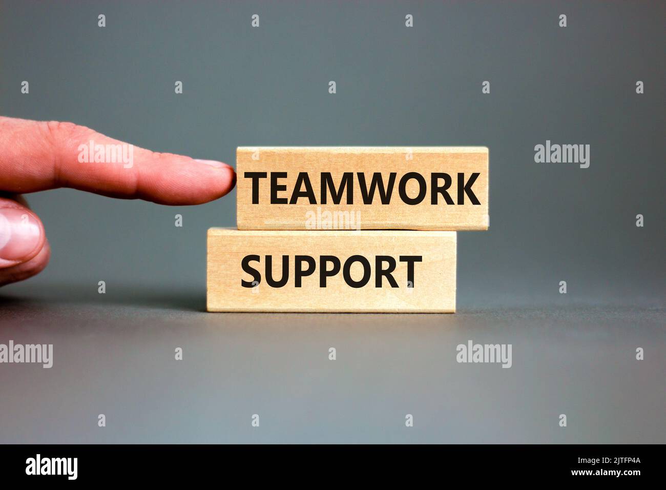 Teamwork support symbol. Concept words Teamwork support on wooden ...