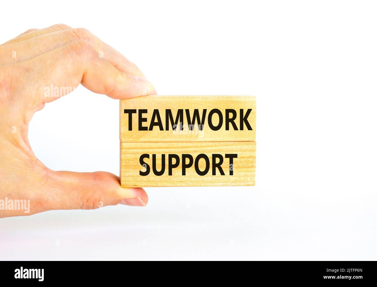 Teamwork support symbol. Concept words Teamwork support on wooden ...