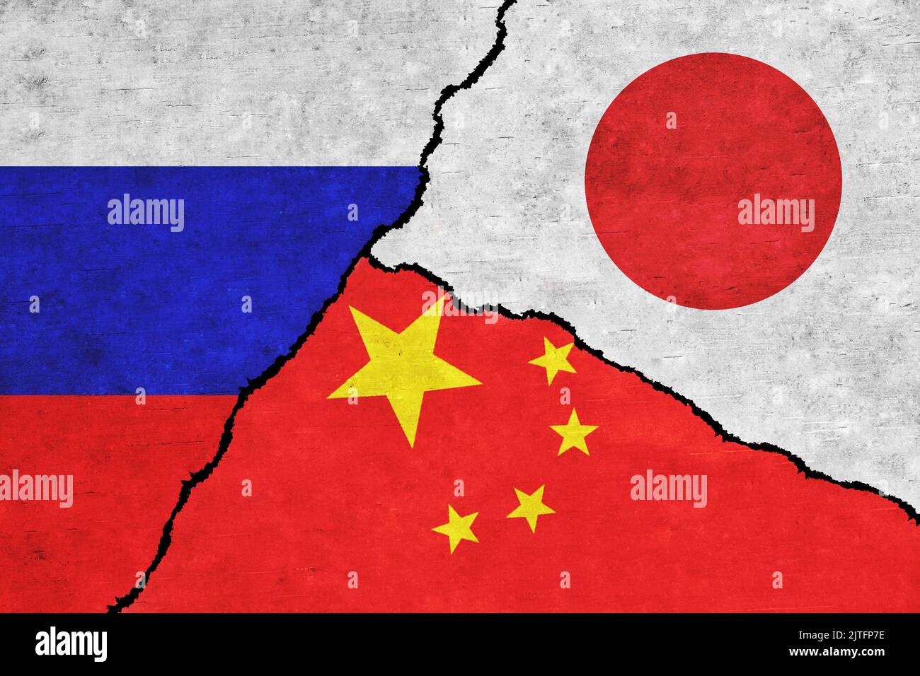 Russia, China and Japan painted flags on a wall with a crack. China ...