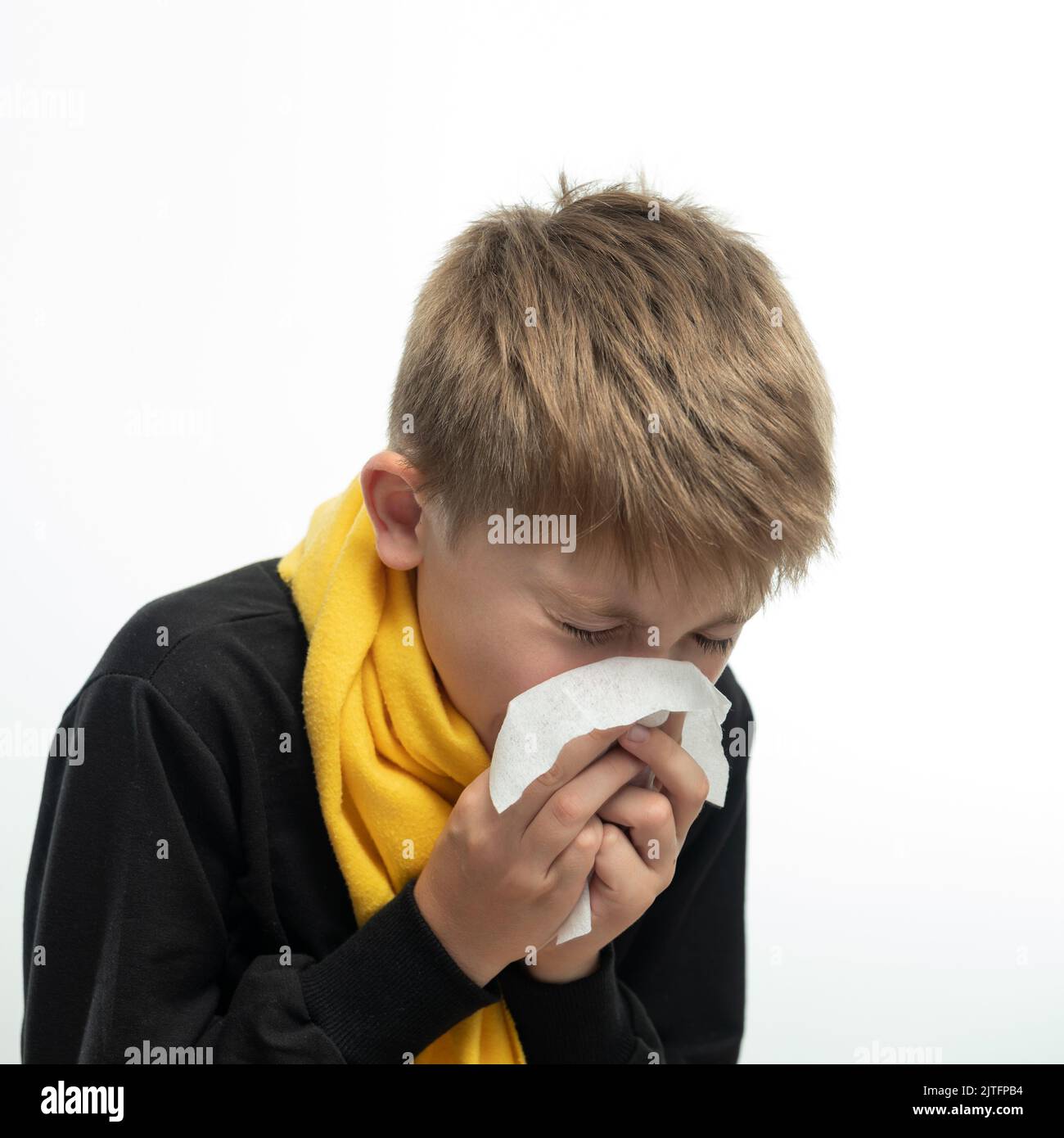 A child blows his nose into a napkin, children's seasonal diseases, a ...