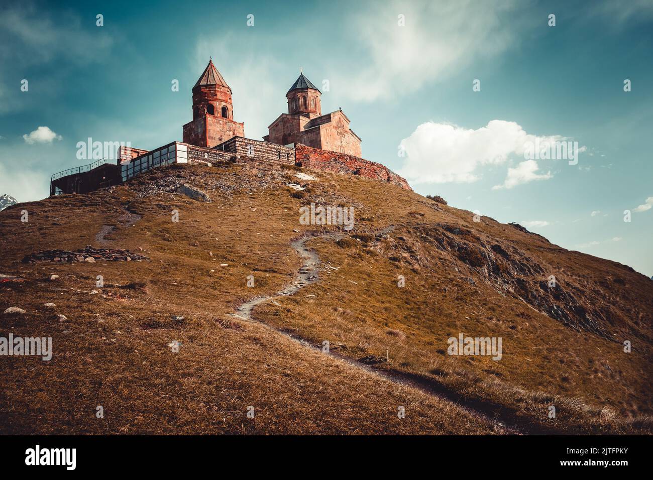 Scenic view of mountain trail to Tsminda Sameba - Holy Trinity Church ...